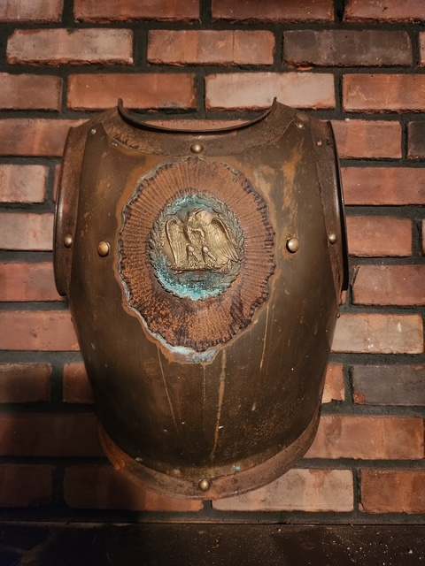 Seeking help identifying these items: breastplate, sword and steel ...
