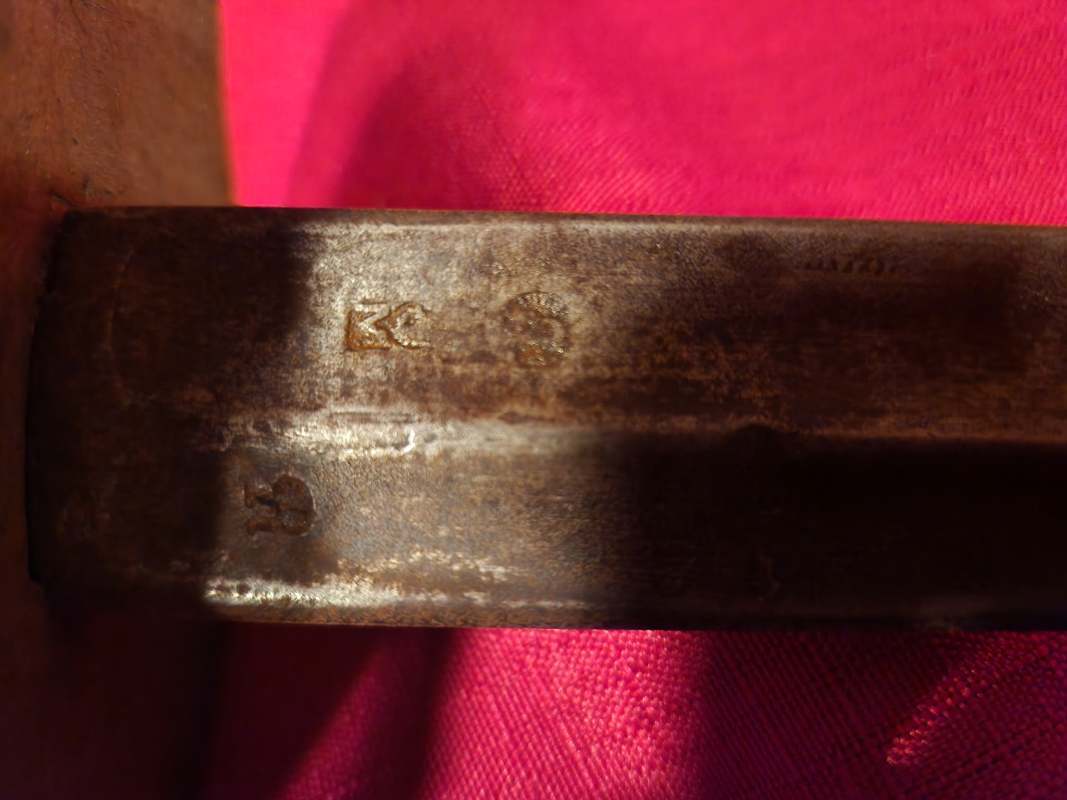 Seeking help identifying these items: breastplate, sword and steel ...