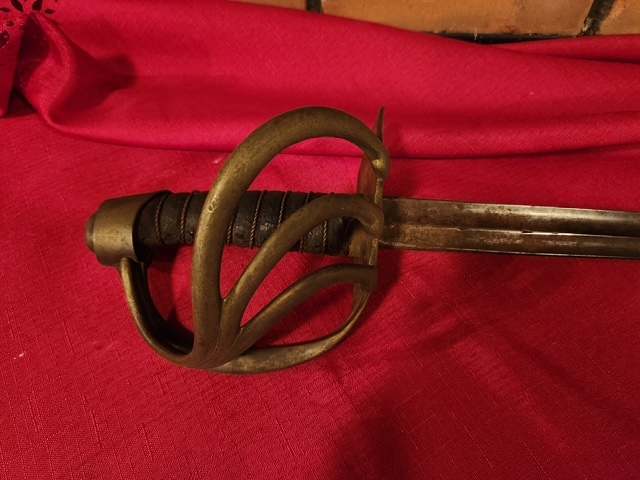 Seeking help identifying these items: breastplate, sword and steel ...