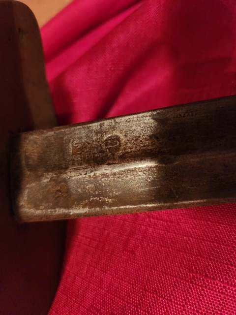 Seeking help identifying these items: breastplate, sword and steel ...