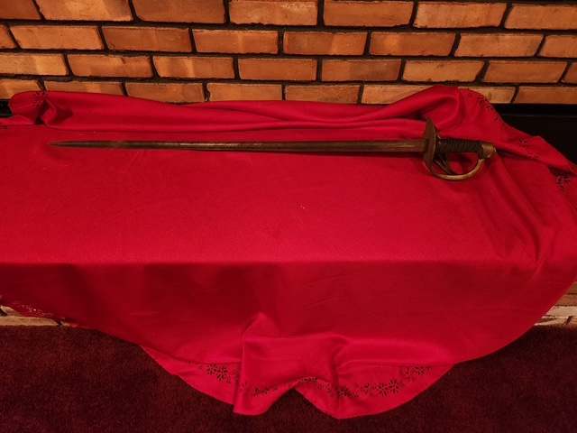 Seeking help identifying these items: breastplate, sword and steel ...